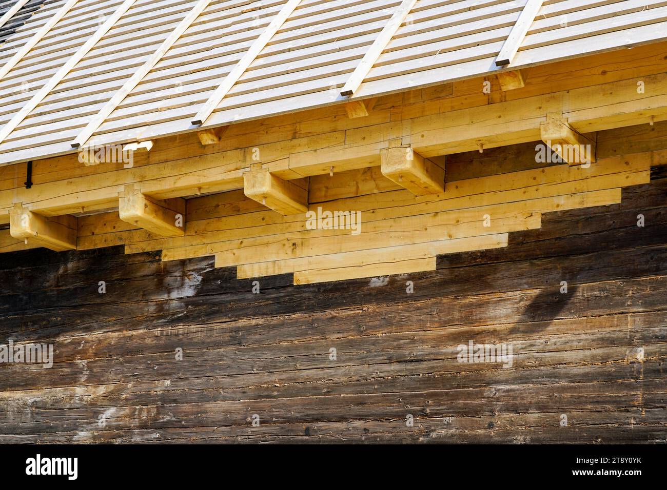 Restoration of the facade of an old wooden building, replacing the ...