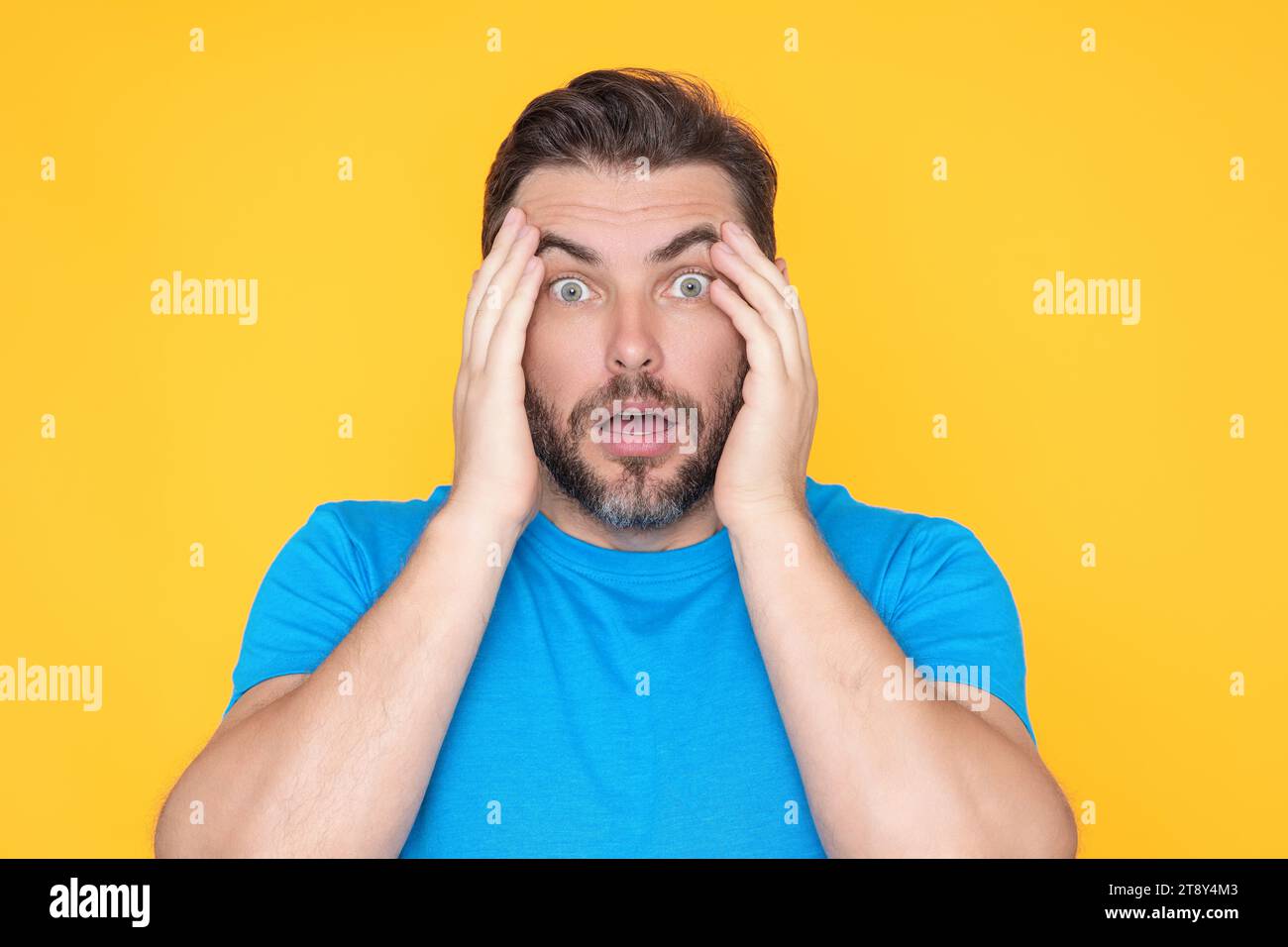 Portrait of surprised man. Wow, it's unbelievable. Shocked man opening ...