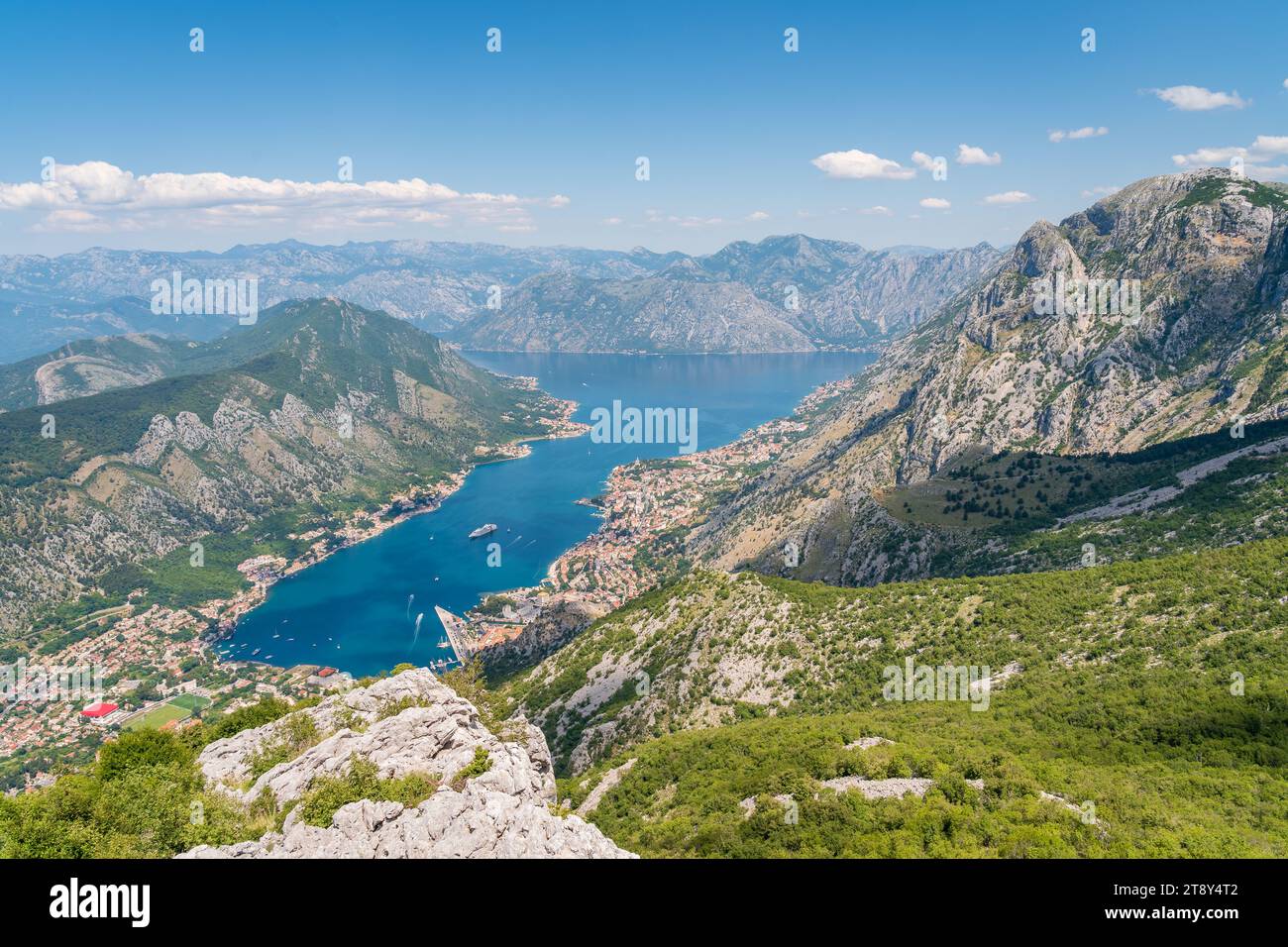 A panoramic view of the Bay of Kotor in Montenegro, surrounded by steep ...