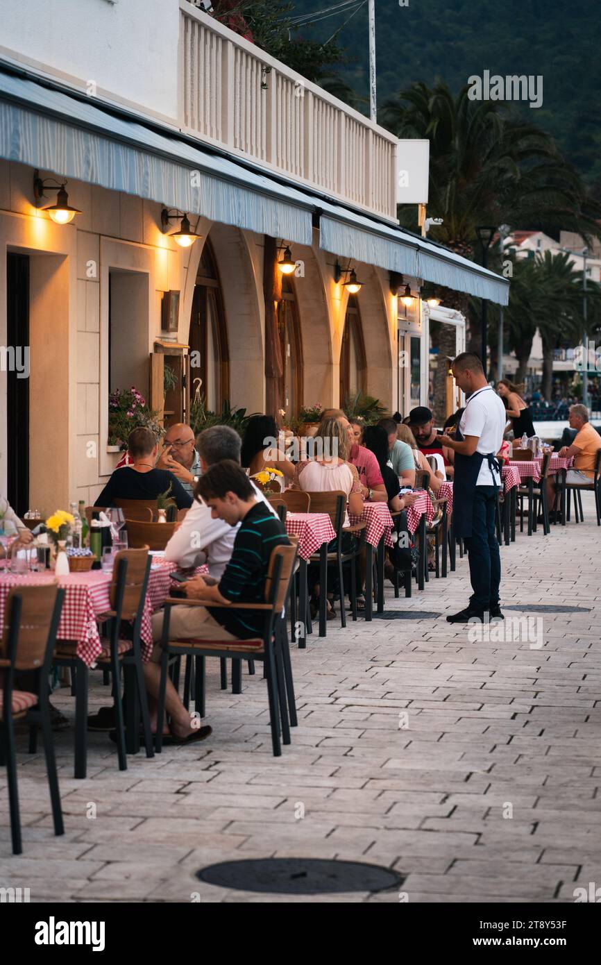 people eating and ordering food in a restaurant terrace Stock Photo - Alamy