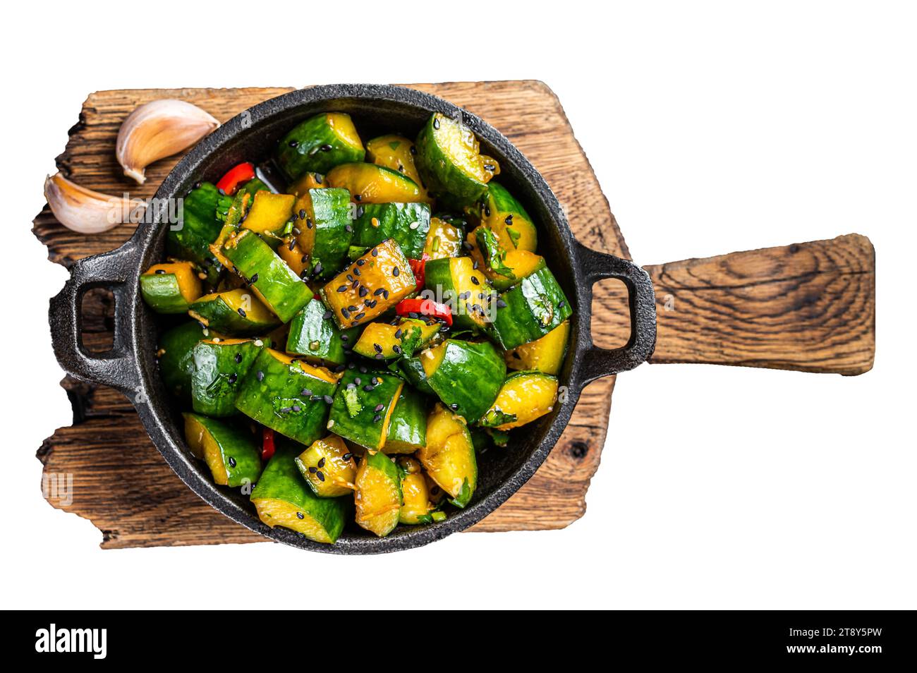 Chinese Smashed Cucumber salad pai huang gua in a skillet. Isolated ...