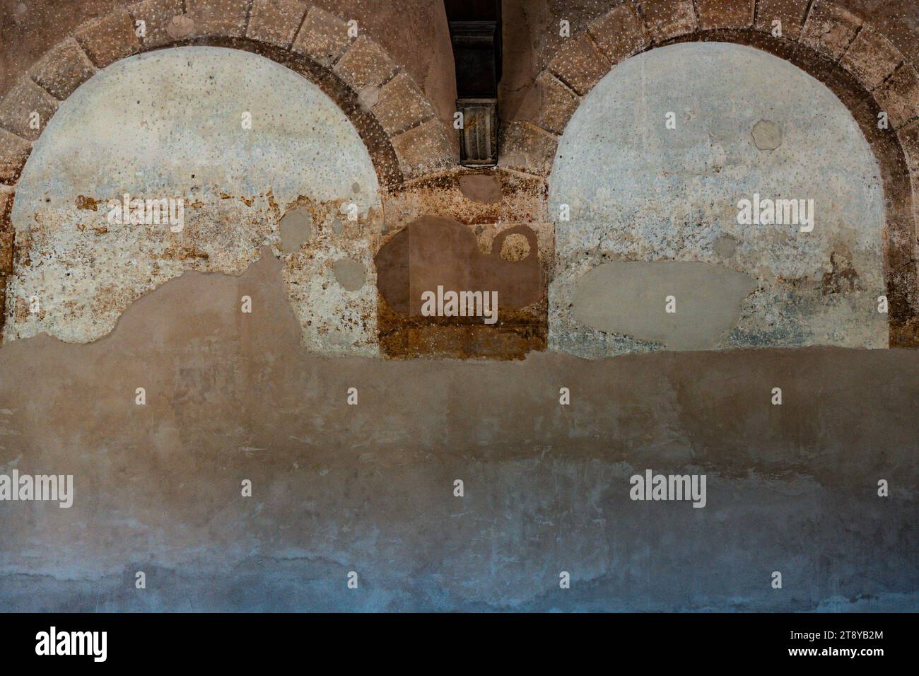 Weathered old, historic wall texture with fading paint and carved ...