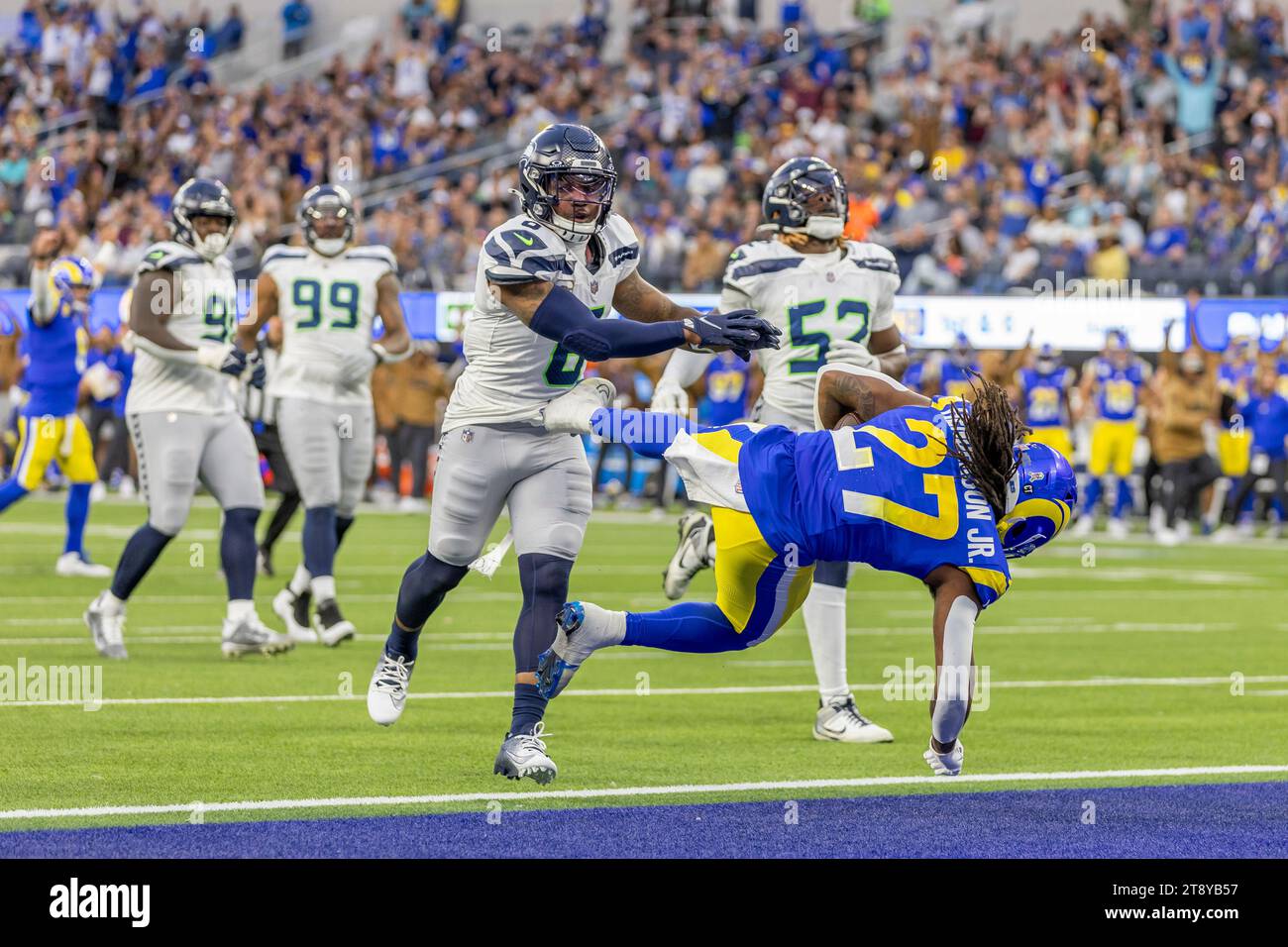 Seattle Seahawks safety Quandre Diggs (6) pushes Los Angeles Rams running back Darrell Henderson ...
