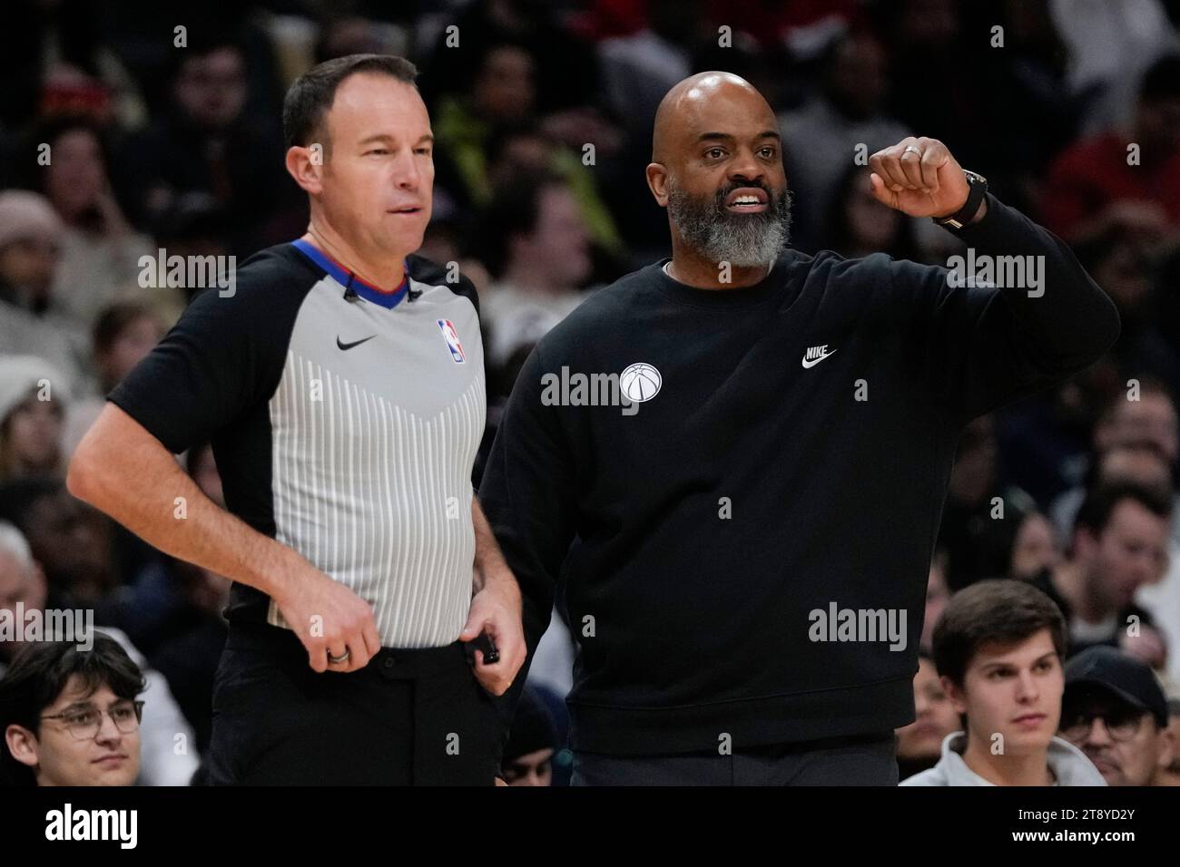 Washington Wizards coach Wes Unseld Jr. talks with referee Josh Tiven ...