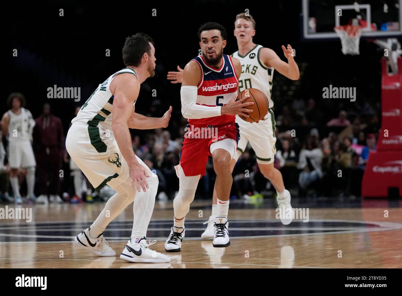 Washington Wizards guard Tyus Jones (5) and Milwaukee Bucks guard Pat ...