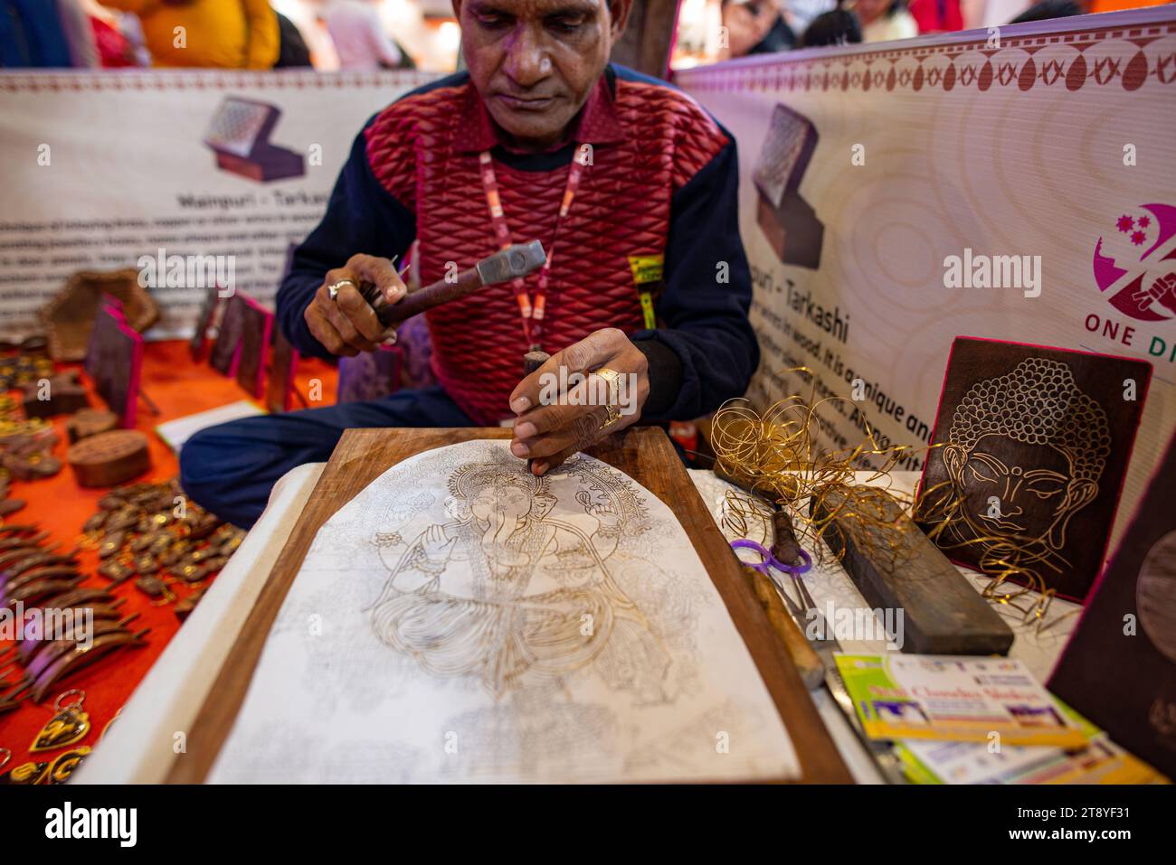 An artisan demonstrates Tarkashi work (Tarkashi is an Indian craft of ...