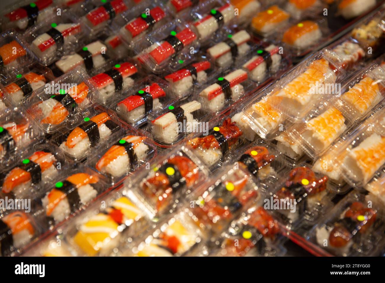 Bunch of Mini sushi on display to buy Stock Photo - Alamy