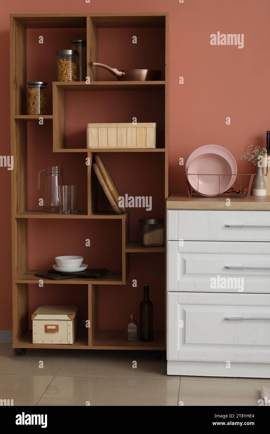 Interior of modern kitchen with white counters and shelving unit Stock ...