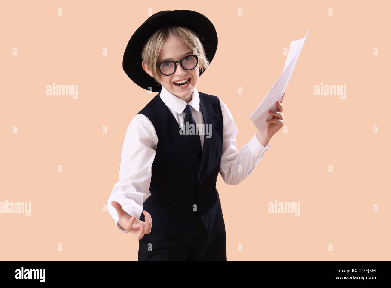 Little actor with film script on beige background Stock Photo - Alamy