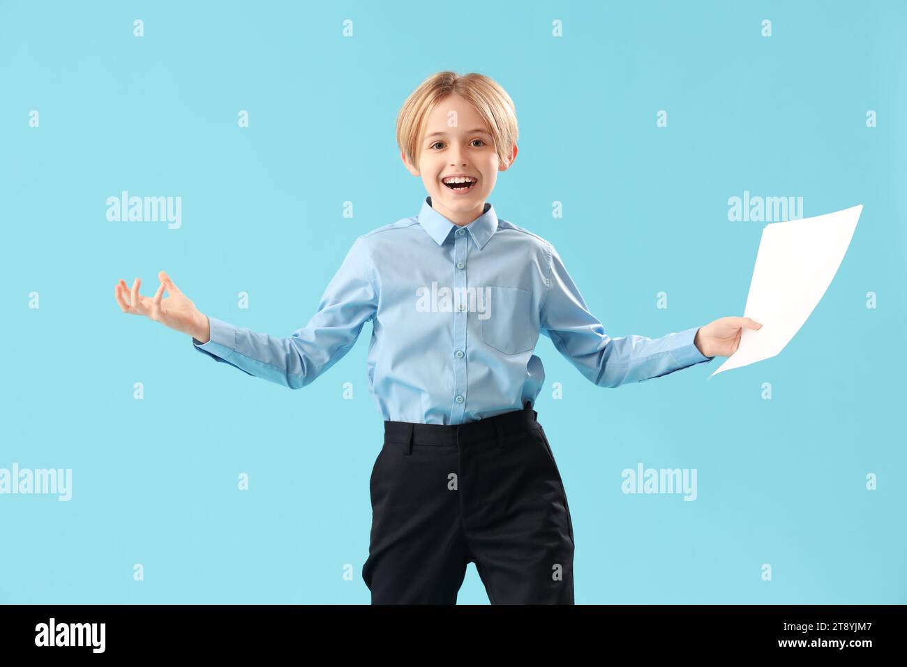 Little actor with film script on blue background Stock Photo - Alamy