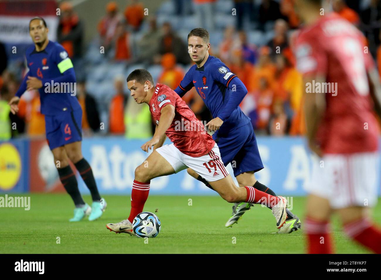 Gibraltar's Tjay De Barr, center left, runs with the ball away from ...