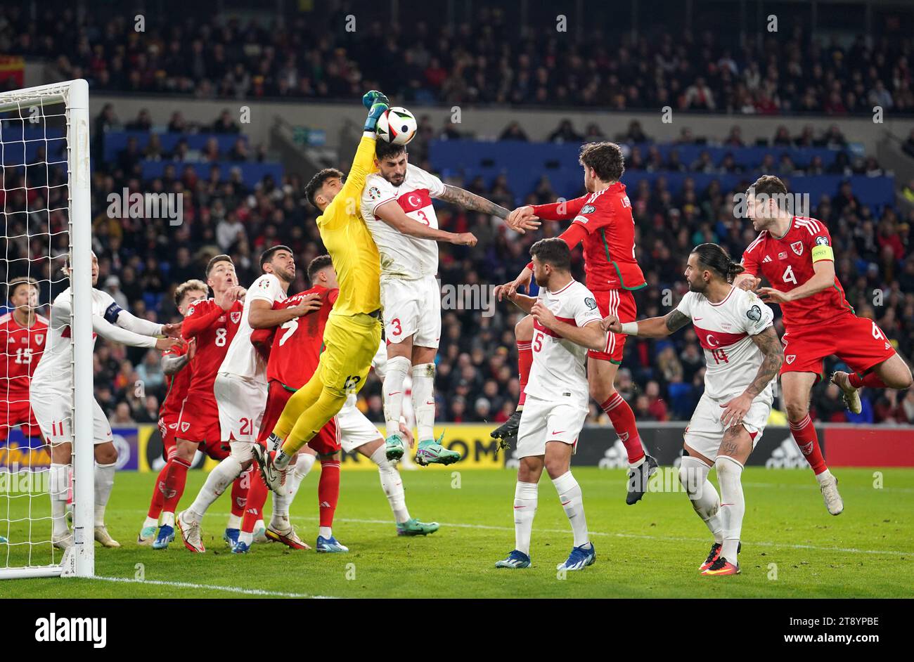 Turkey goalkeeper Altay Bayindir jumps to clear the ballduring the UEFA ...
