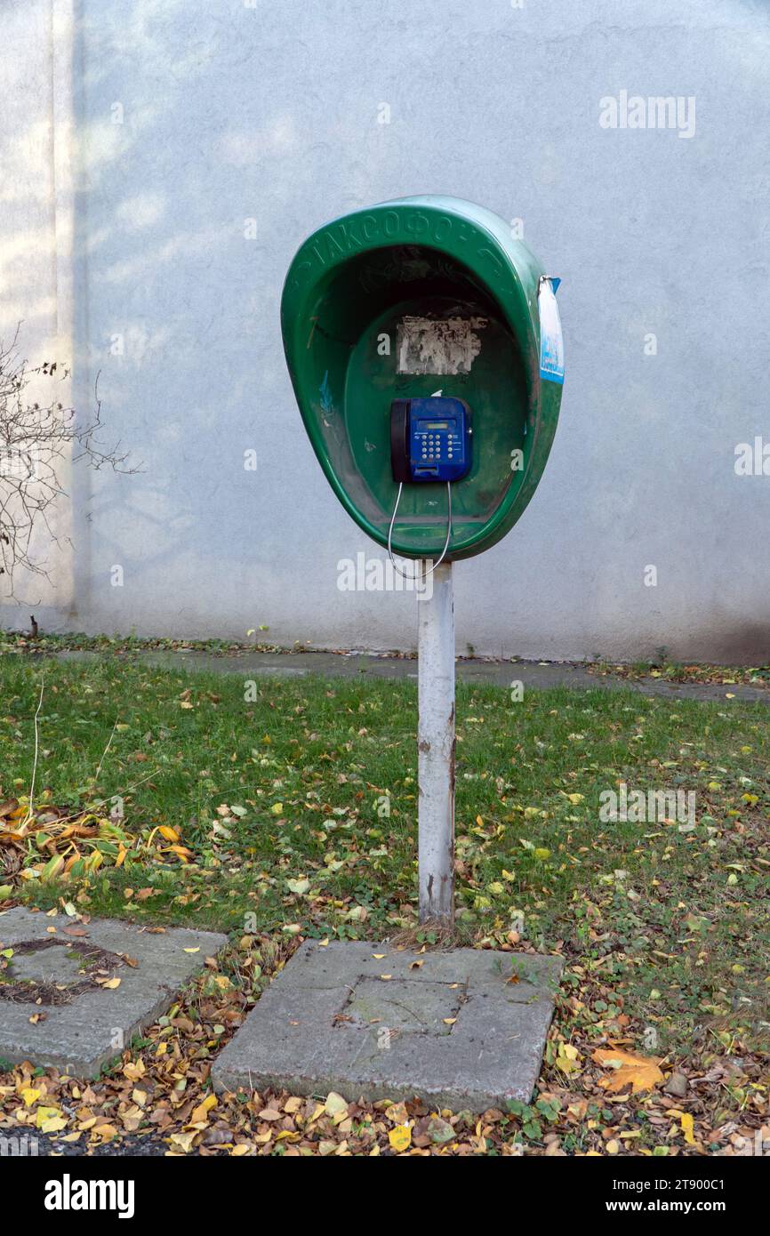 old blue public telephone (payphone). Texture background of a vintage ...