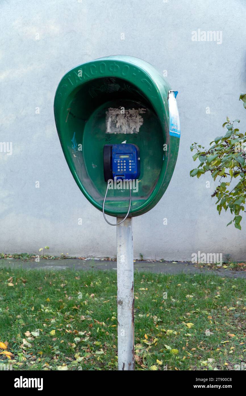 old blue public telephone (payphone). Texture background of a vintage ...
