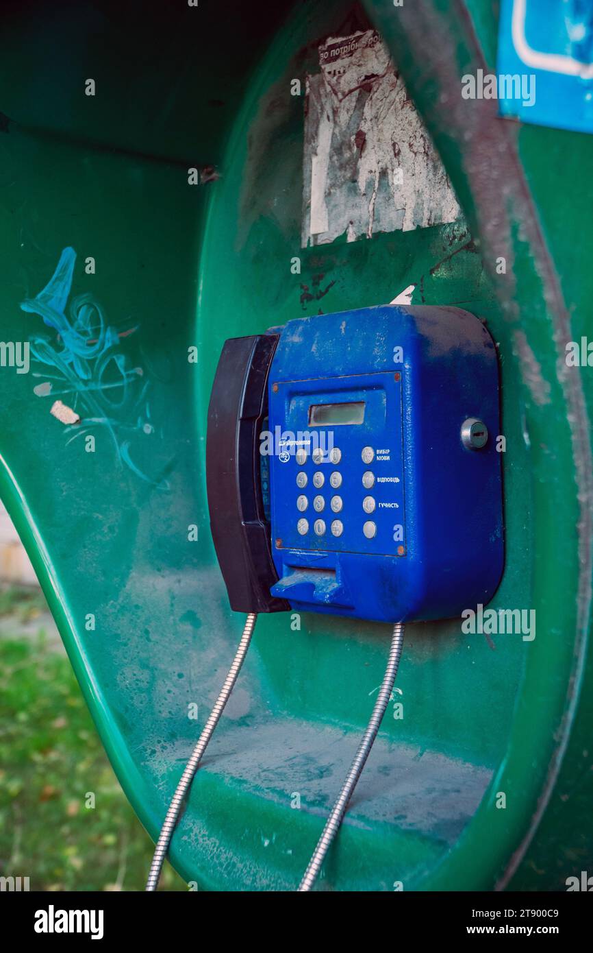 old blue public telephone (payphone). Texture background of a vintage ...