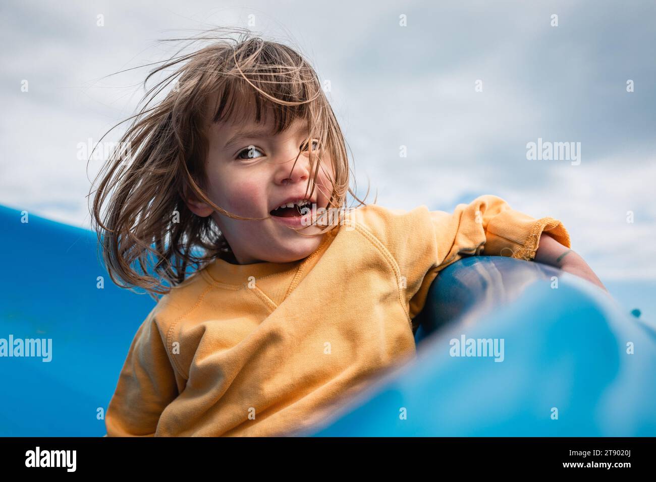Going down the slide hi-res stock photography and images - Alamy