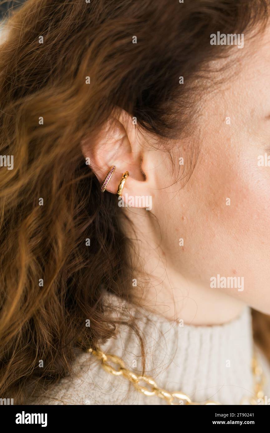 Gold ear cuff hi-res stock photography and images - Alamy