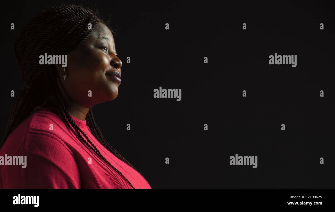 Beautiful female african american beauty gesturing to the side with ...