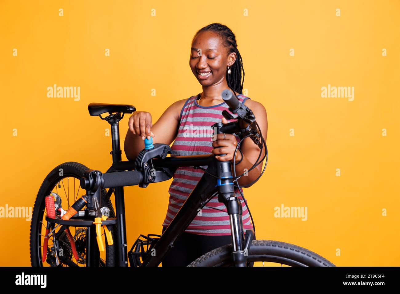 Sports-loving african american female inspects a repair stand for ...