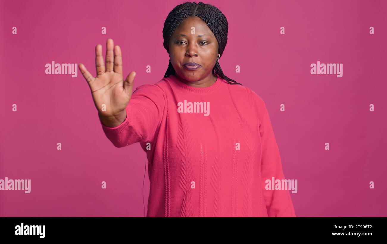 African american lady with denying using stop hand gesture towards ...
