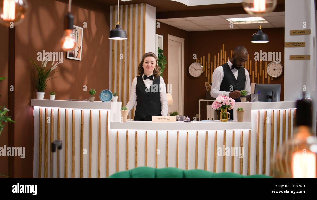 Guests in line at hotel front desk hi-res stock photography and images ...