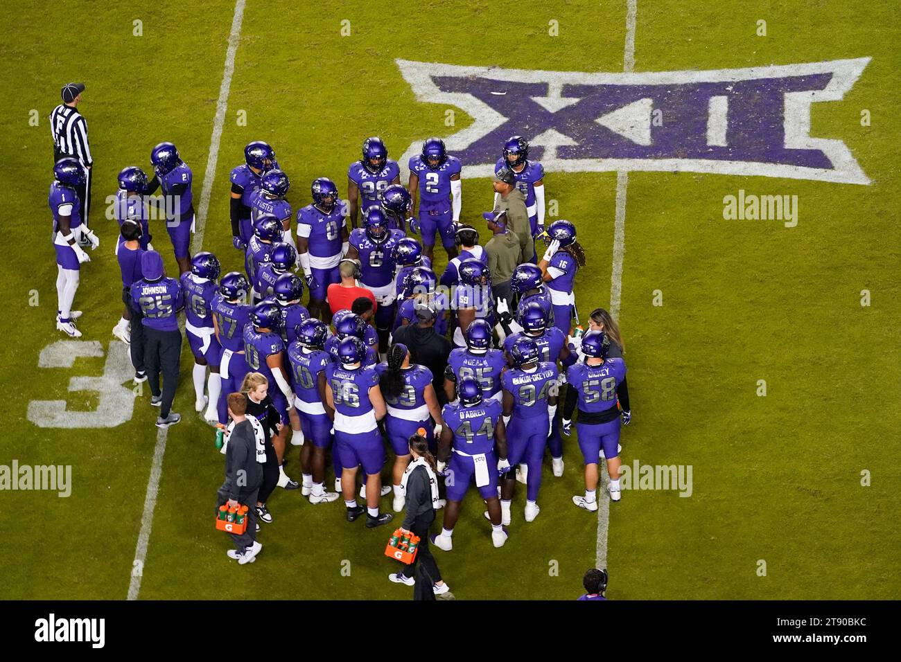 TCU players gather during the second half of an NCAA college football ...