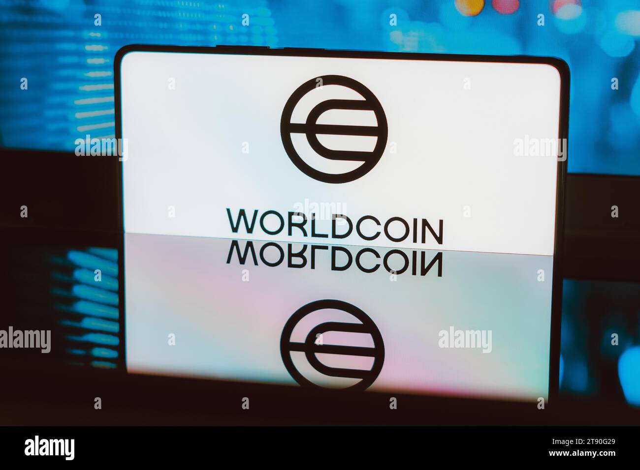 In this photo illustration, the Worldcoin logo is displayed on a ...
