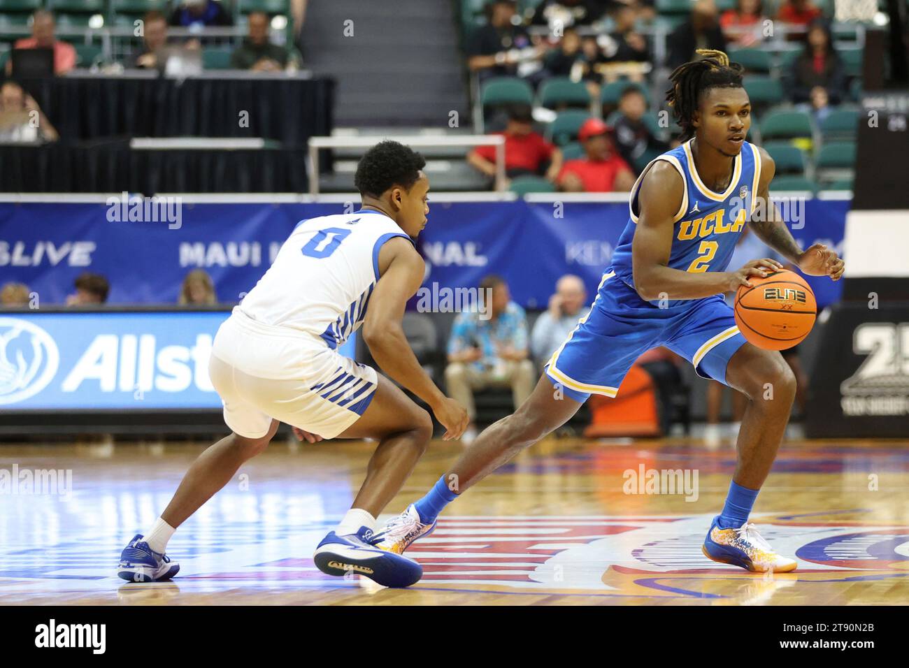 Chaminade guard Jamir Thomas (0) chases UCLA guard Dylan Andrews (2 ...