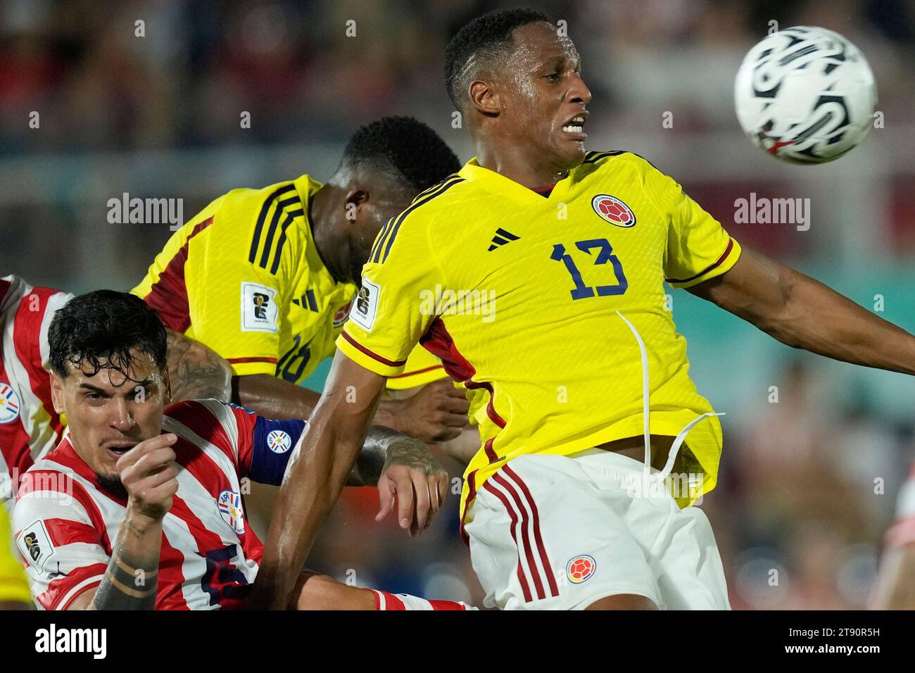 Colombia's Jerry Mina goes for a header challenged by Paraguay's ...