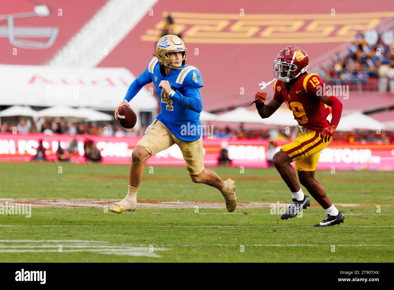UCLA Bruins quarterback Ethan Garbers (4) rolls out to pass against USC ...