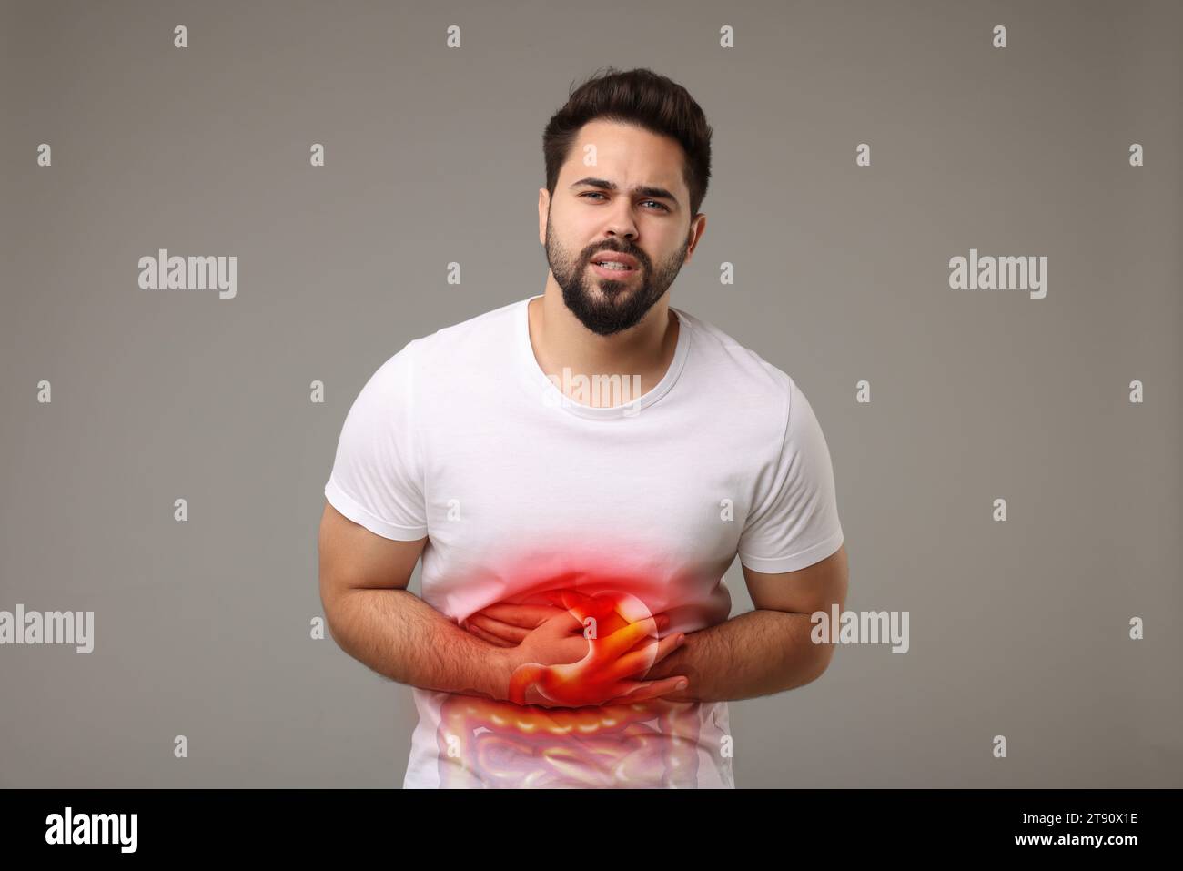 Man suffering from stomach ache on grey background. Illustration of ...