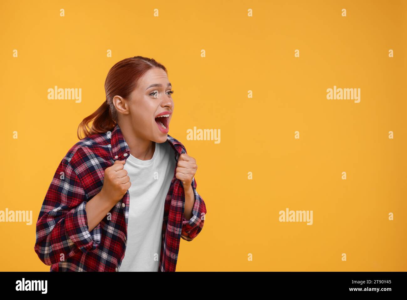 Emotional fan on yellow background, space for text Stock Photo - Alamy