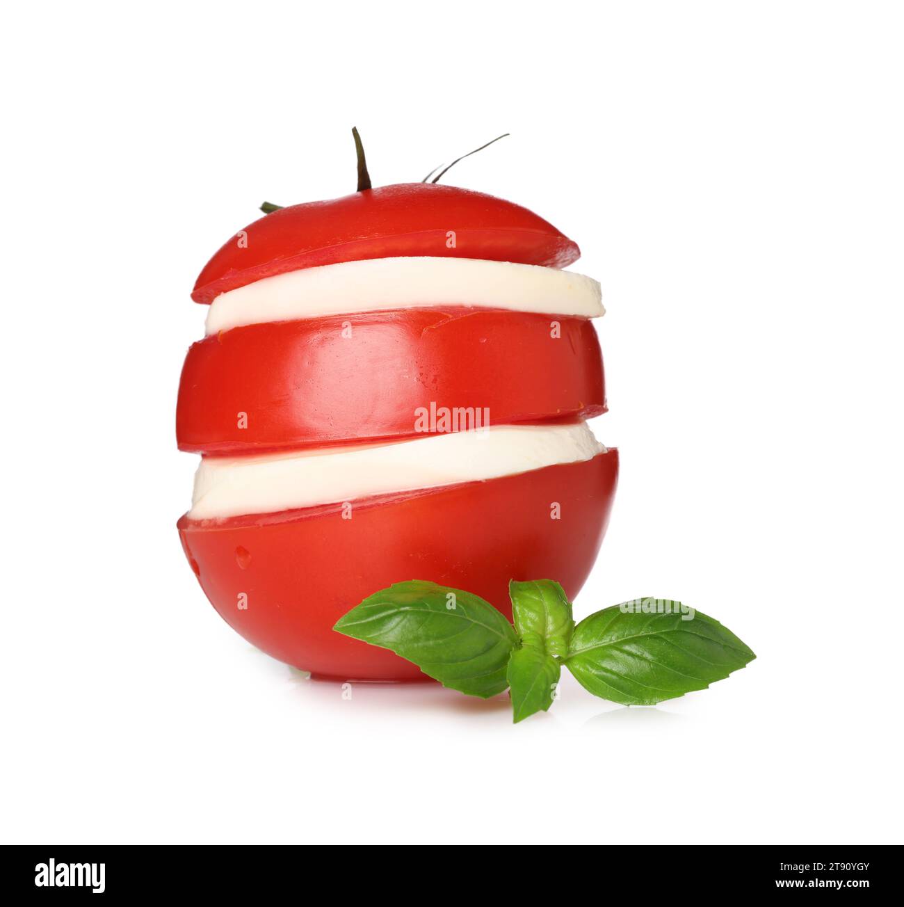Delicious mozzarella cheese, cut tomato and basil leaves isolated on ...
