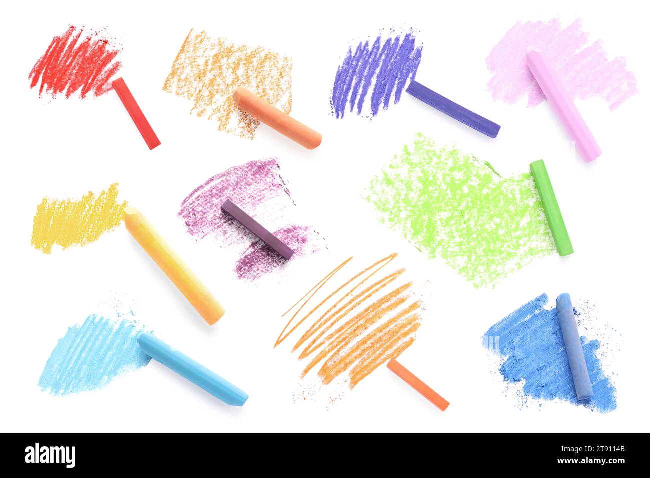 Colorful soft pastels and scribbles on white background, top view ...
