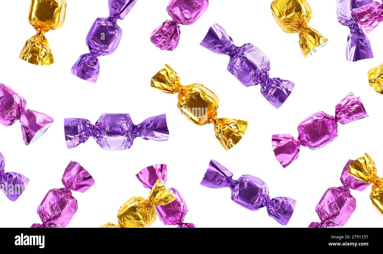 Tasty candies in bright wrappers falling on white background Stock ...