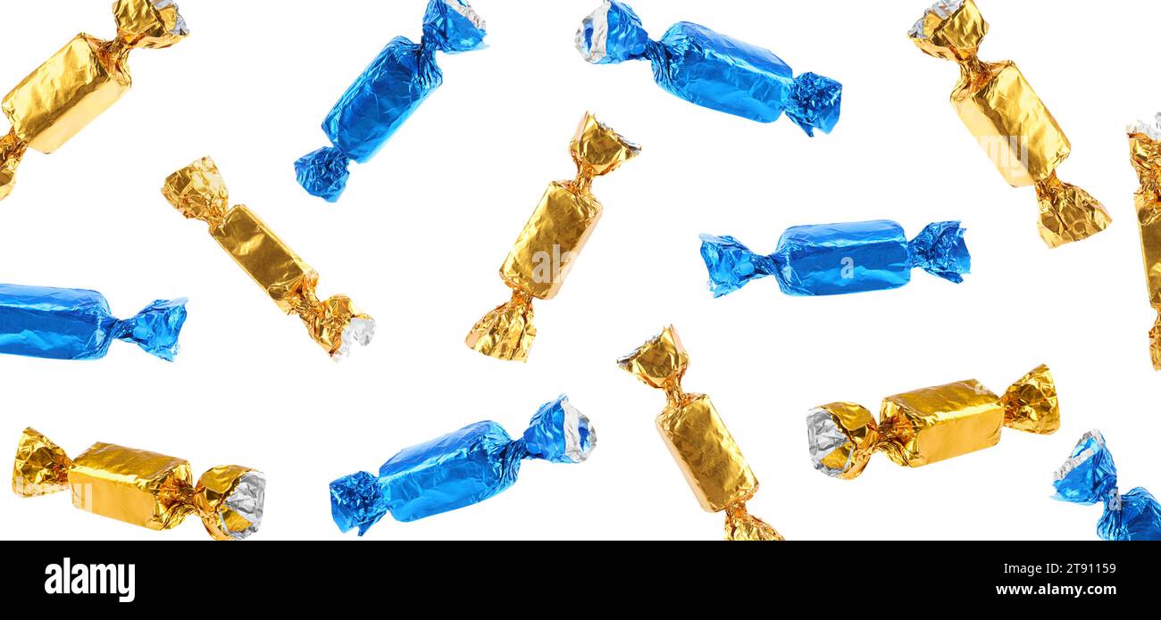 Tasty candies in bright wrappers falling on white background Stock ...