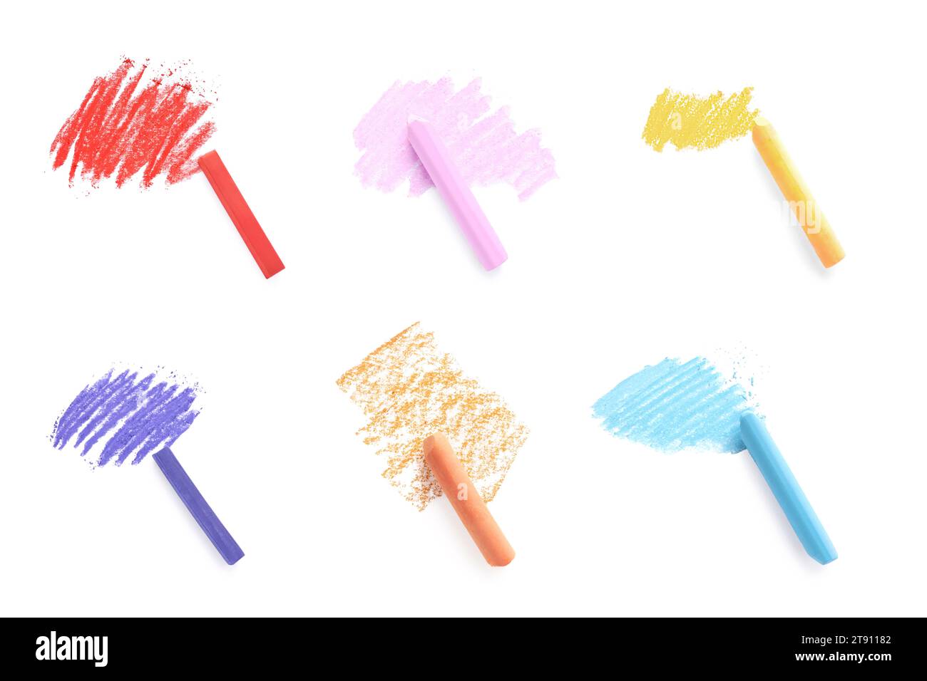Colorful soft pastels and scribbles on white background, top view ...