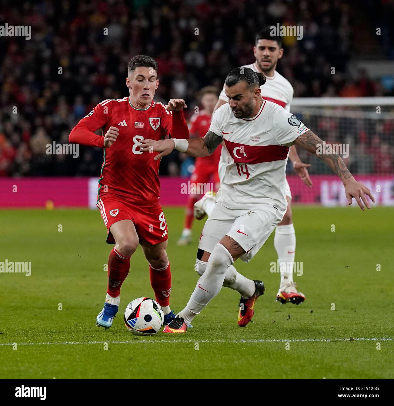 Cardiff, UK. 21st Nov, 2023. Harry Wilson (Wales) (L) is tackled by ...