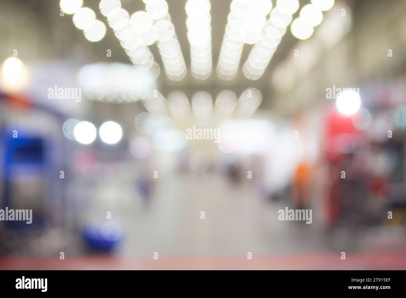 Large high building premises with people walking inside. Blurred ...