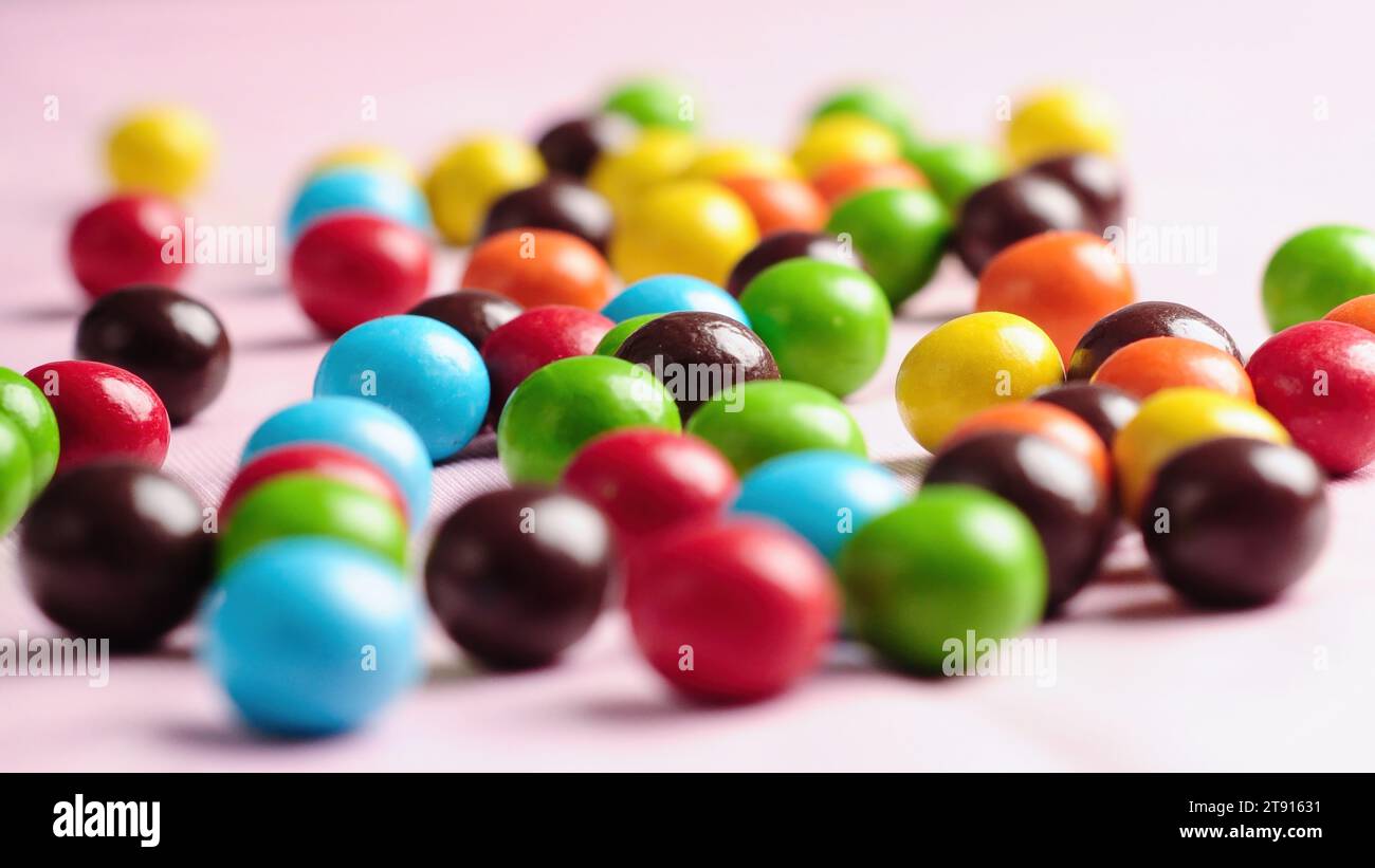 several colorful round candies are scattered on the floor Stock Photo ...
