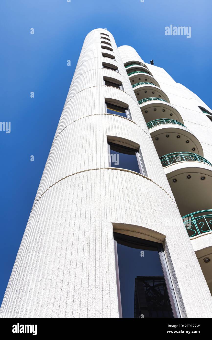 image of a unique residential building in Tokyo, Japan, in a low angle ...