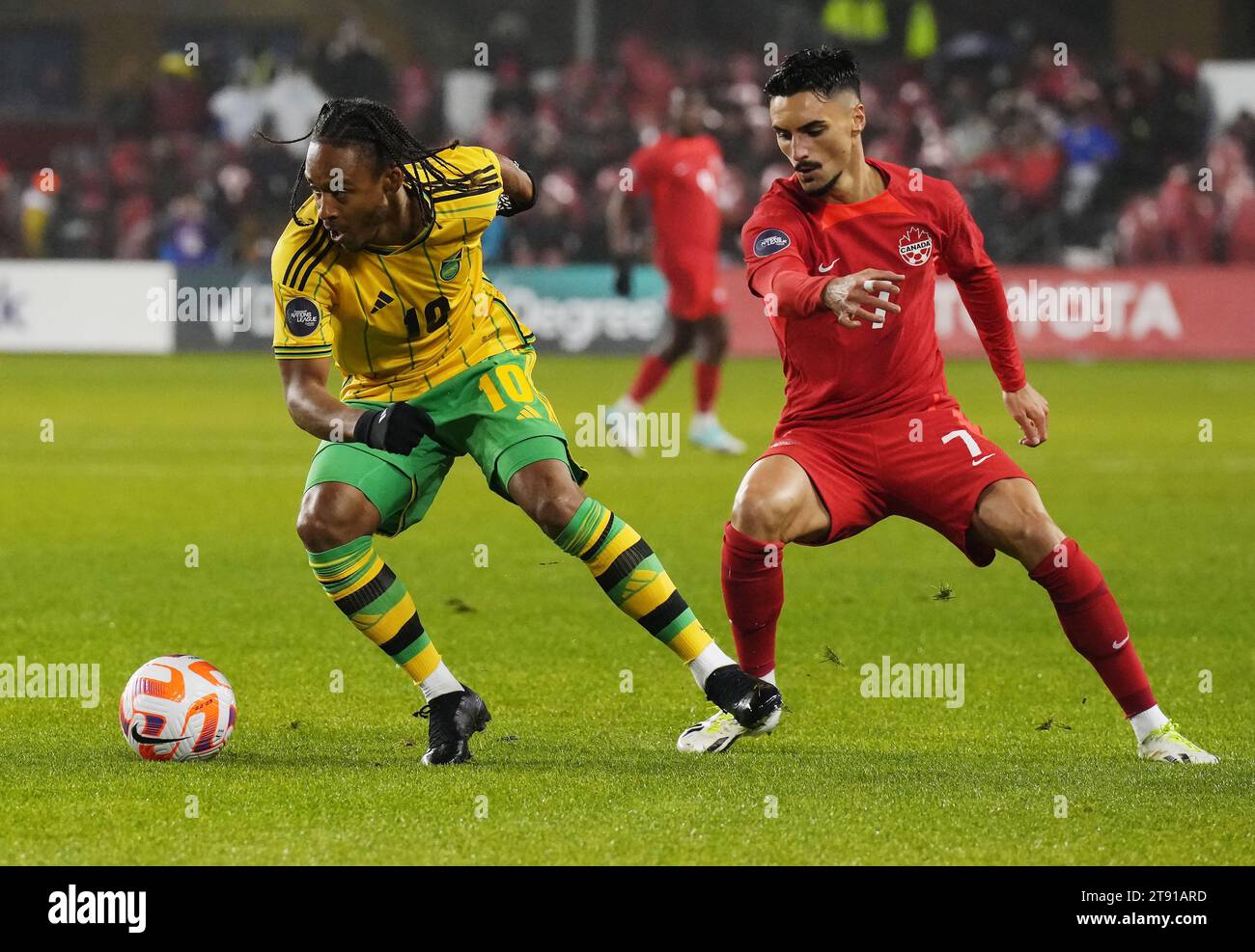 Toronto, Canada. 21st Nov, 2023. Jamaica's Bobby Reid (10) protects the ...
