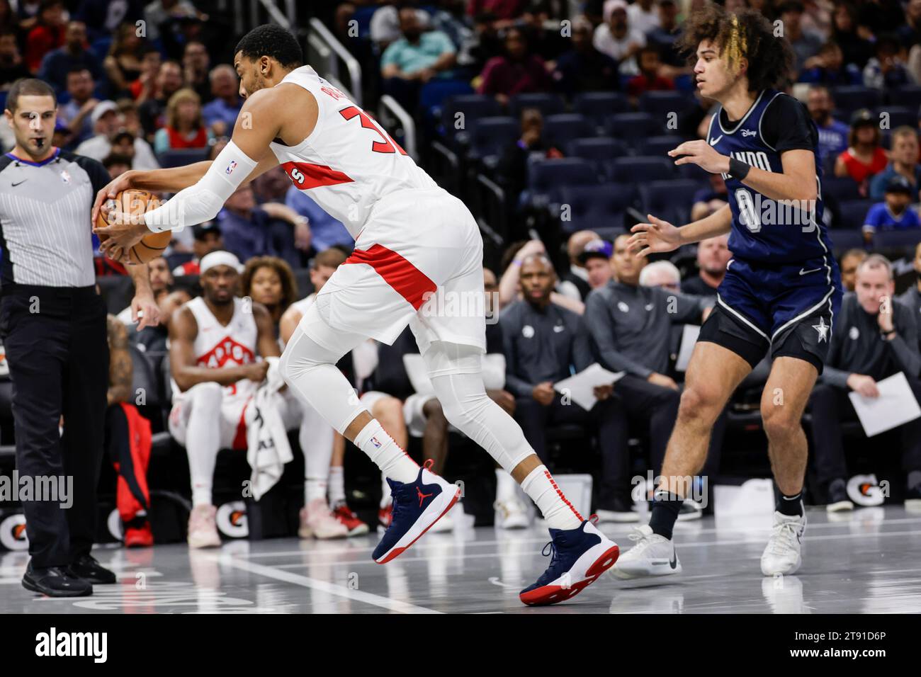 Toronto Raptors forward Otto Porter Jr., left, tries to save the ball ...