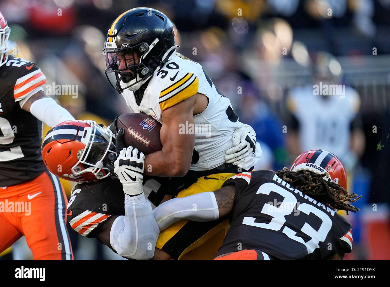 Pittsburgh Steelers running back Jaylen Warren (30) is tackled by ...