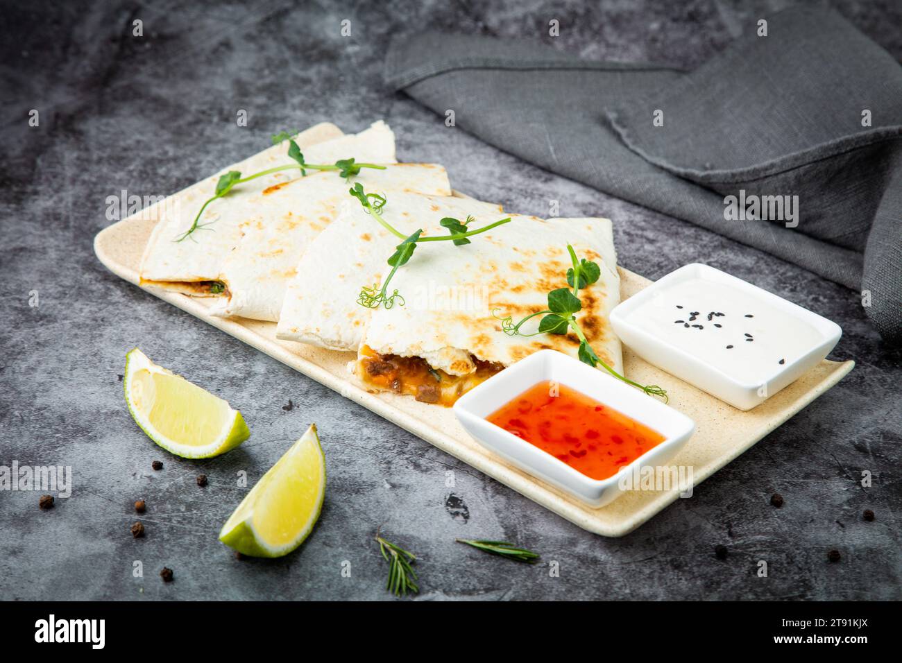 crispy flatbreads stuffed with meat, herbs, lime and two sauces, side ...