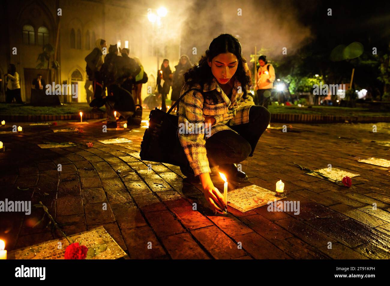 Bogota, Colombia. 20th Nov, 2023. A transgender person is seen lighting ...