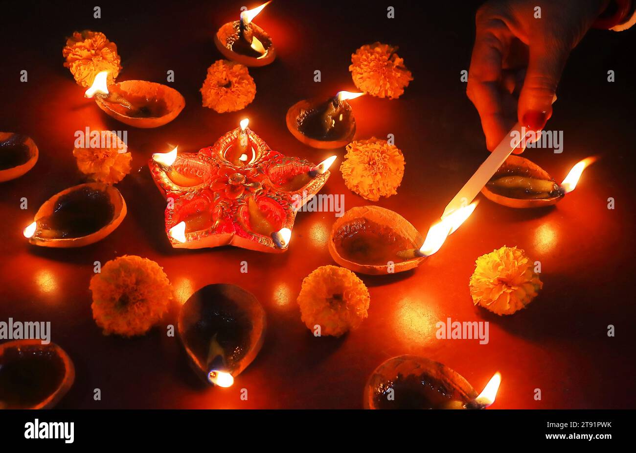 traditional oil lamps lit at the night during diwali or deepavali ...