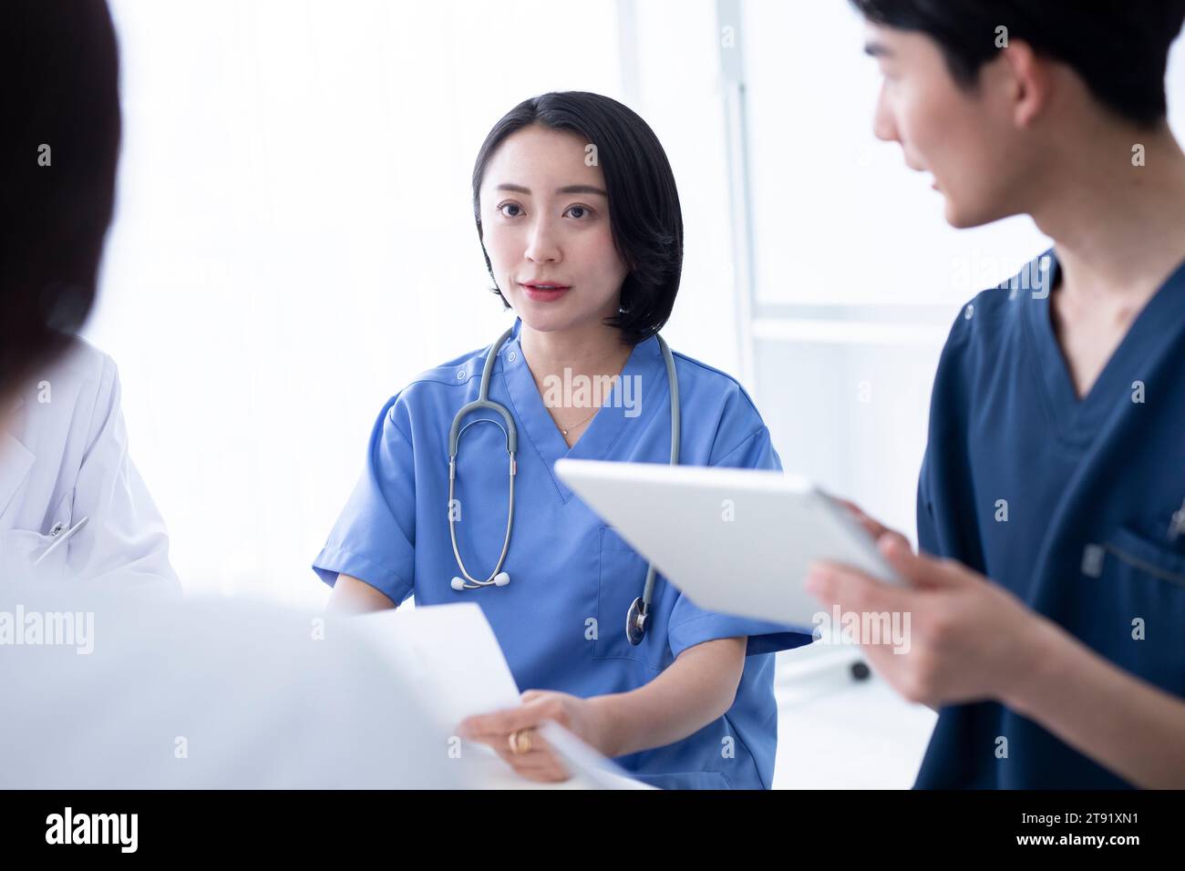 Doctor and nurse having a meeting Stock Photo - Alamy
