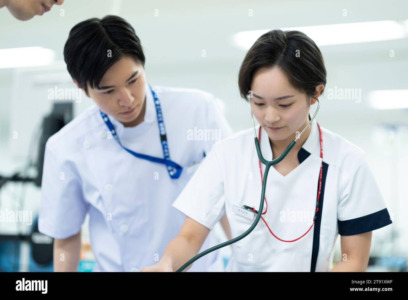 nurse listening to heartbeat Stock Photo - Alamy