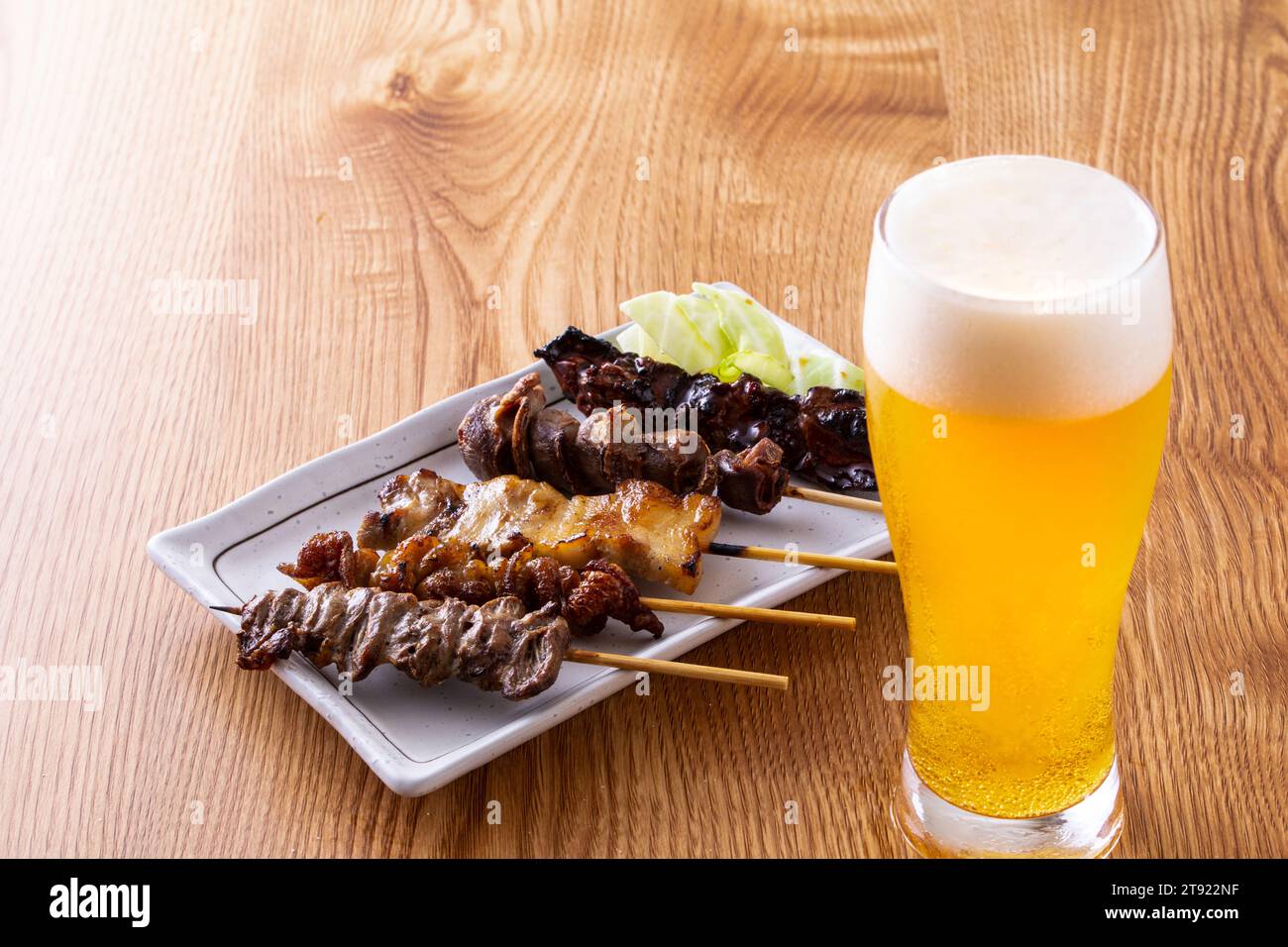 Draft beer and yakitori at a Japanese izakaya Stock Photo - Alamy